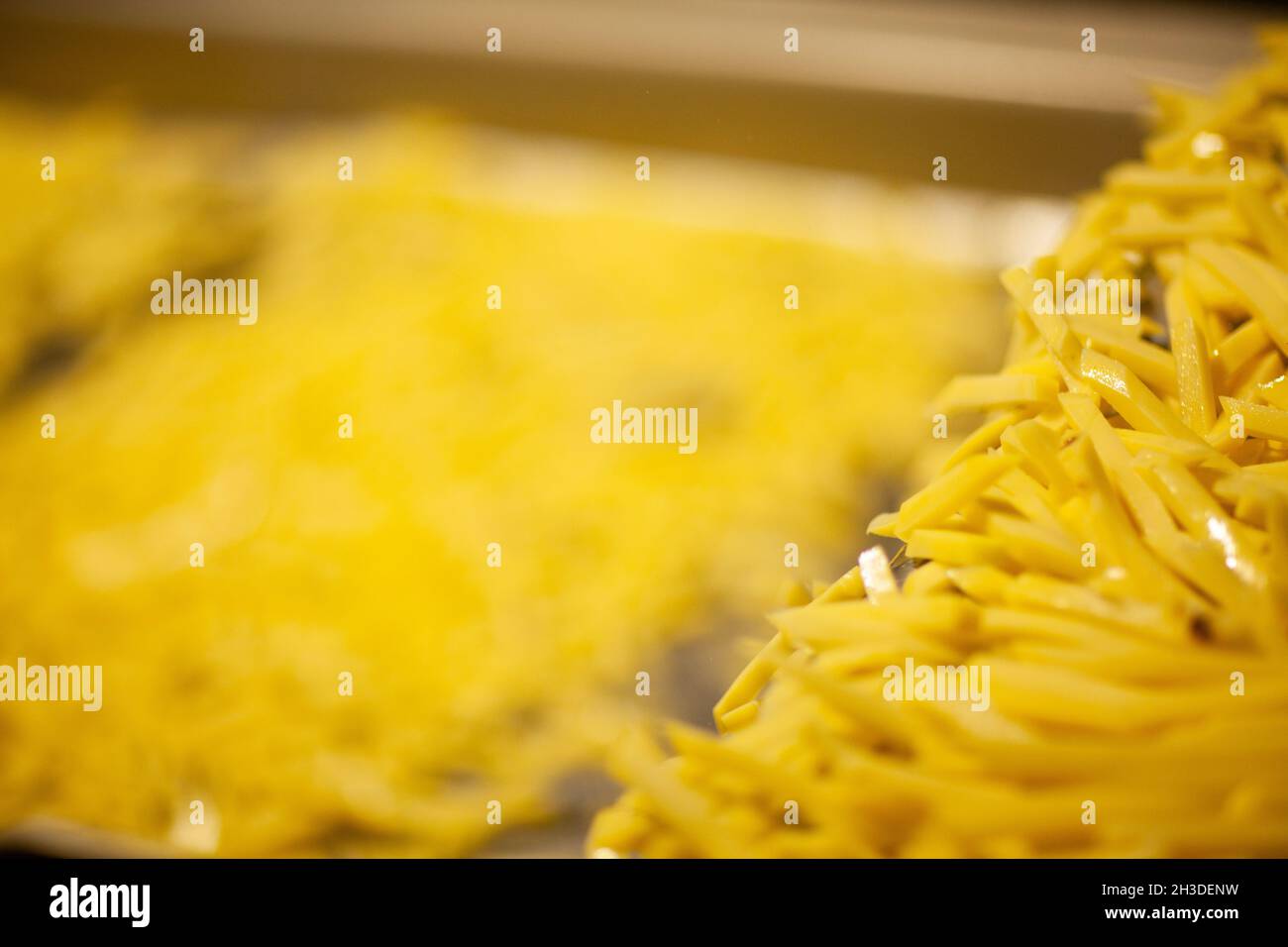 Production line of a potato factory. French fries - fast food Stock ...