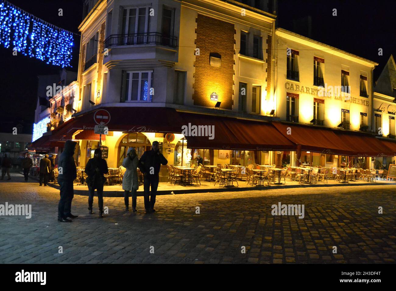 Very cute, colorful and pink cafe facade in Paris Street during night ...