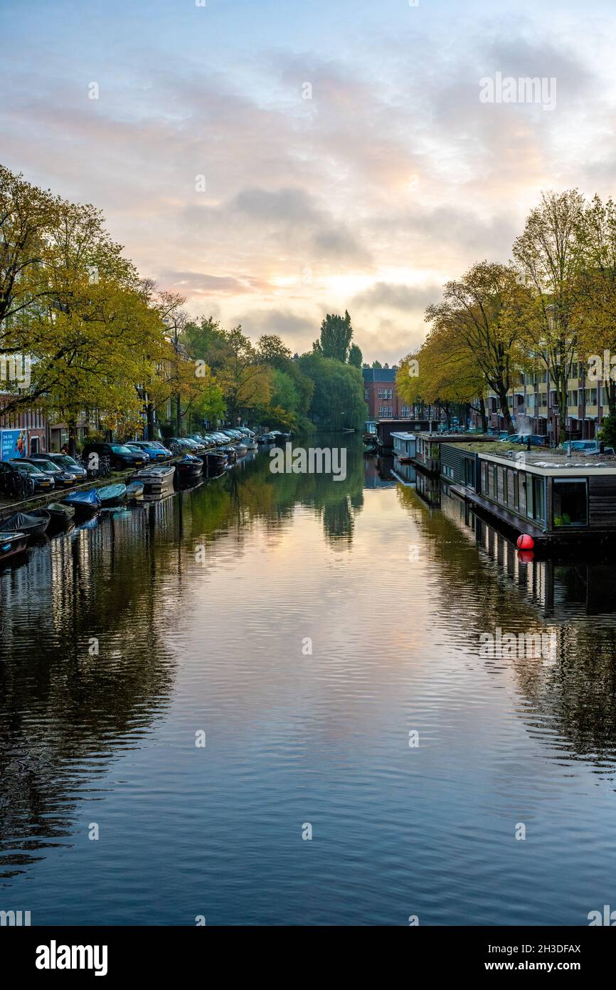 Amsterdam sunset city skyline at canal waterfront, Amsterdam ...