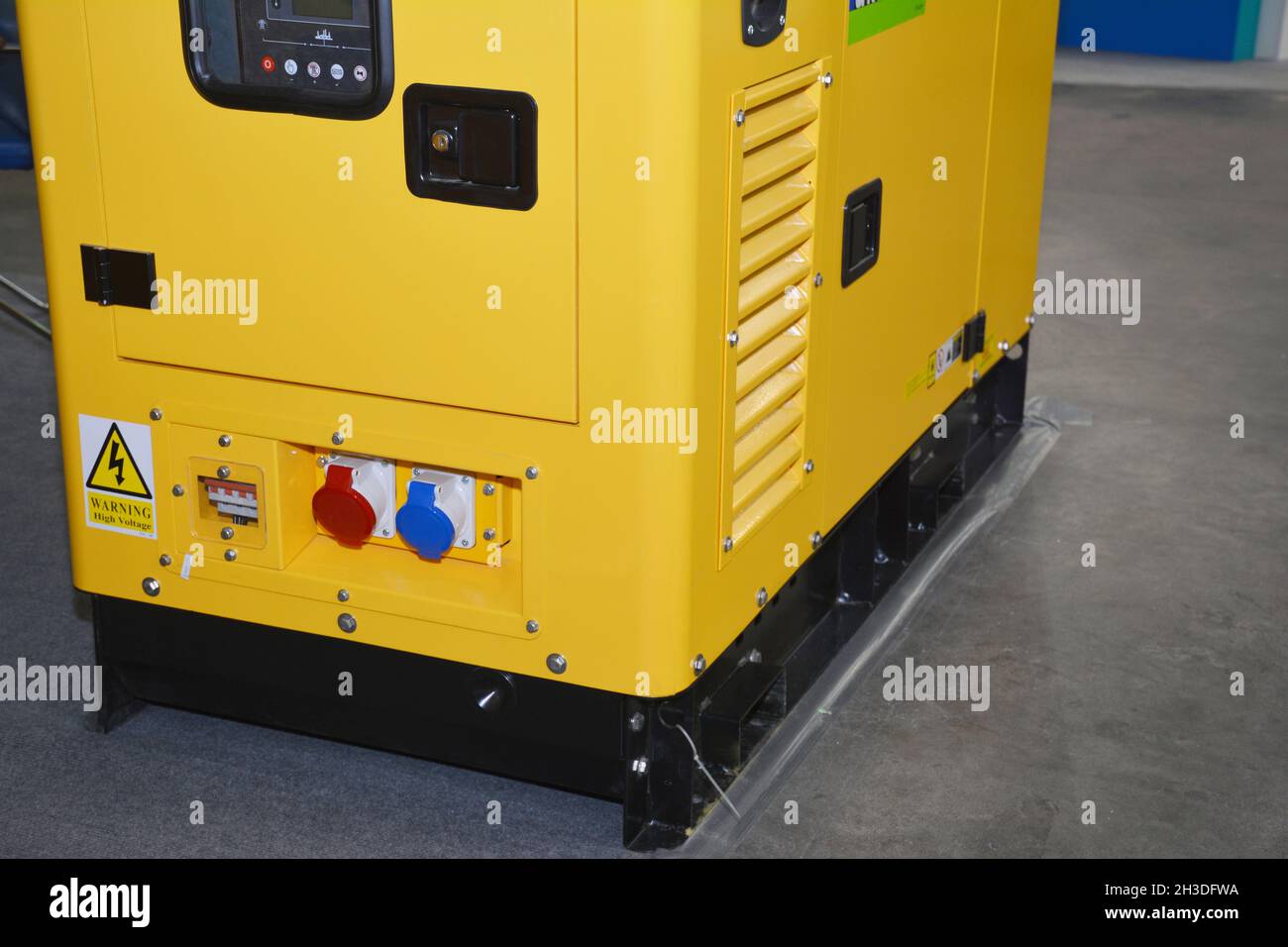 Close up on standby power diesel backup generator for home with control ...