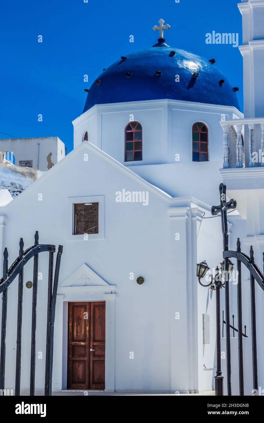 Classic Greek church architecture with a blue dome and white washed ...