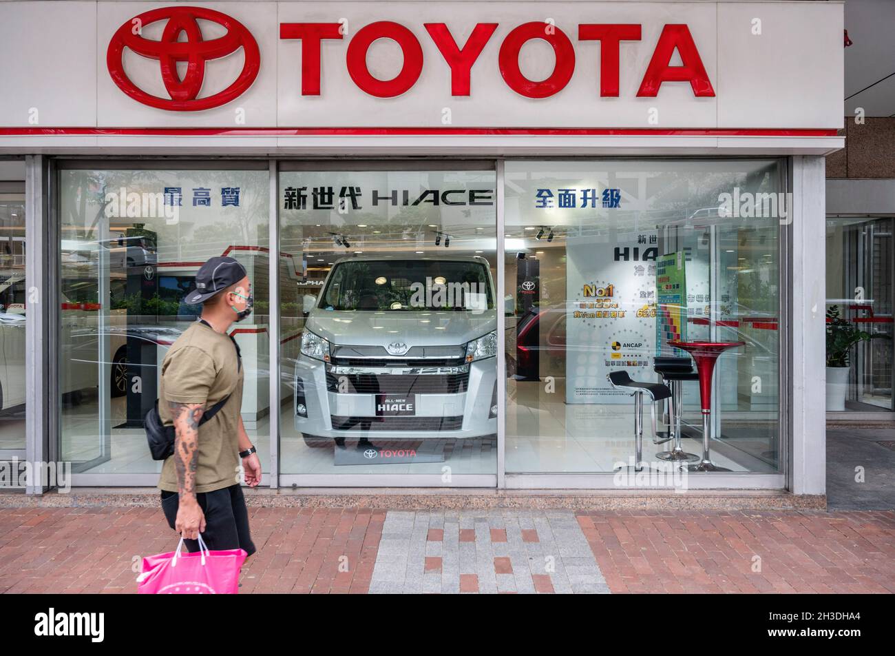 Hong Kong, China. 06th Oct, 2021. A pedestrian walks past the Japanese ...
