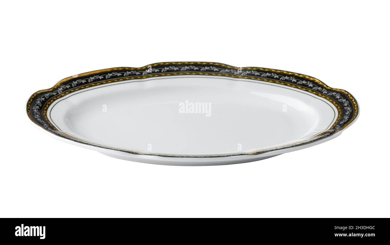 White ceramic table plate with golden border isolated on white ...