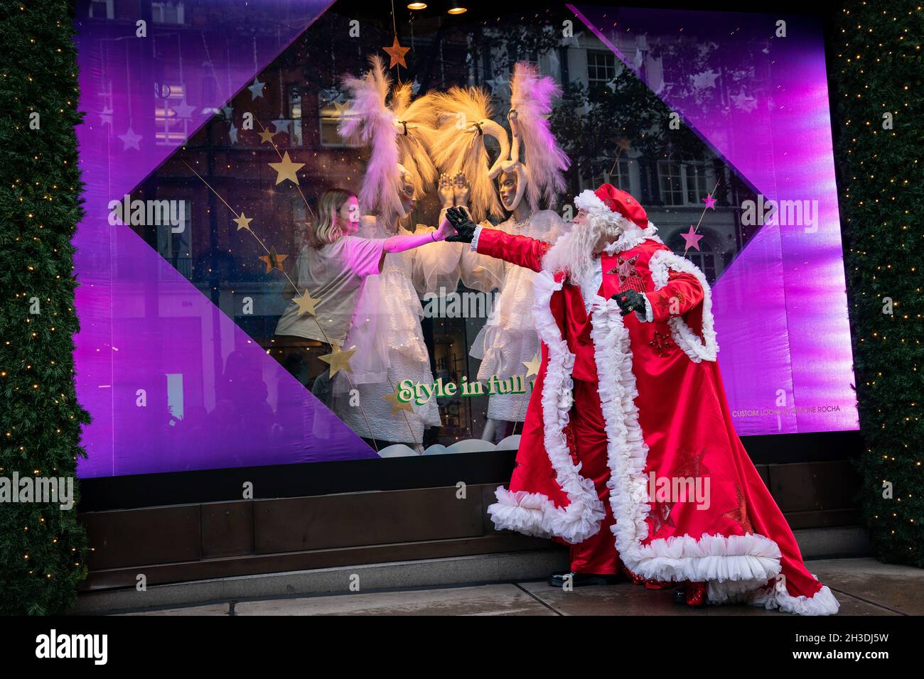 A man dressed as Santa Claus outside Selfridges in London as the ...