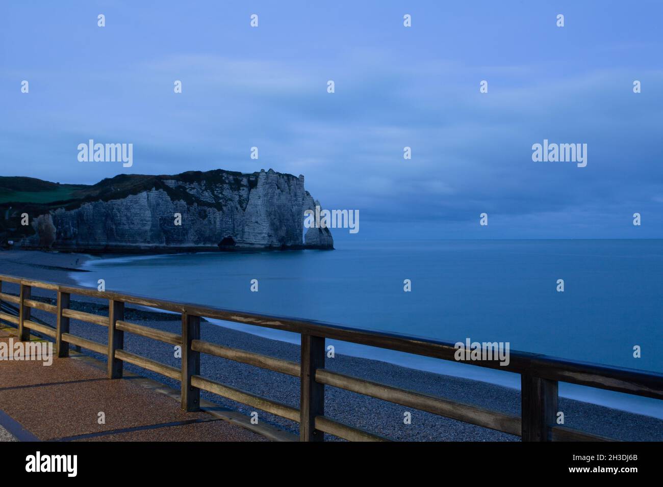 Very early morning on the beach in Etretat. Etretat is a charming town ...