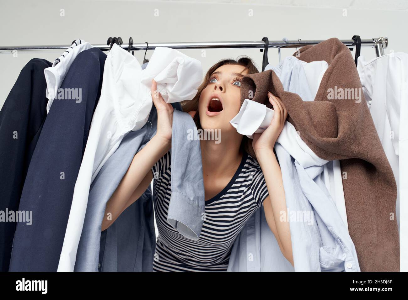 pretty woman trying on clothes shop retail isolated background Stock ...