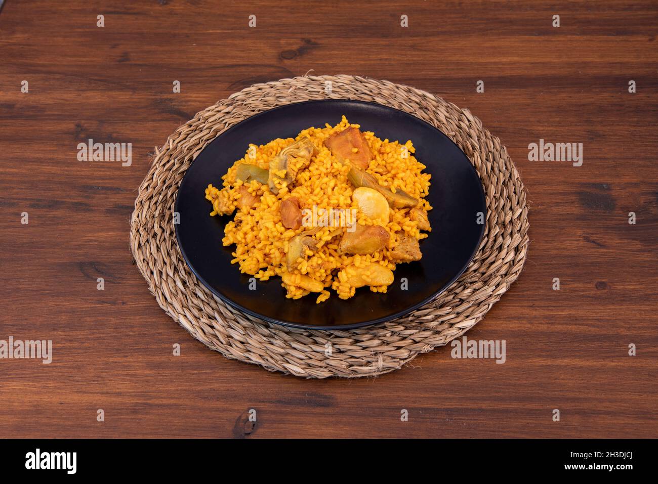 Plate of Valencian paella with vegetables and chicken, garrafon beans ...