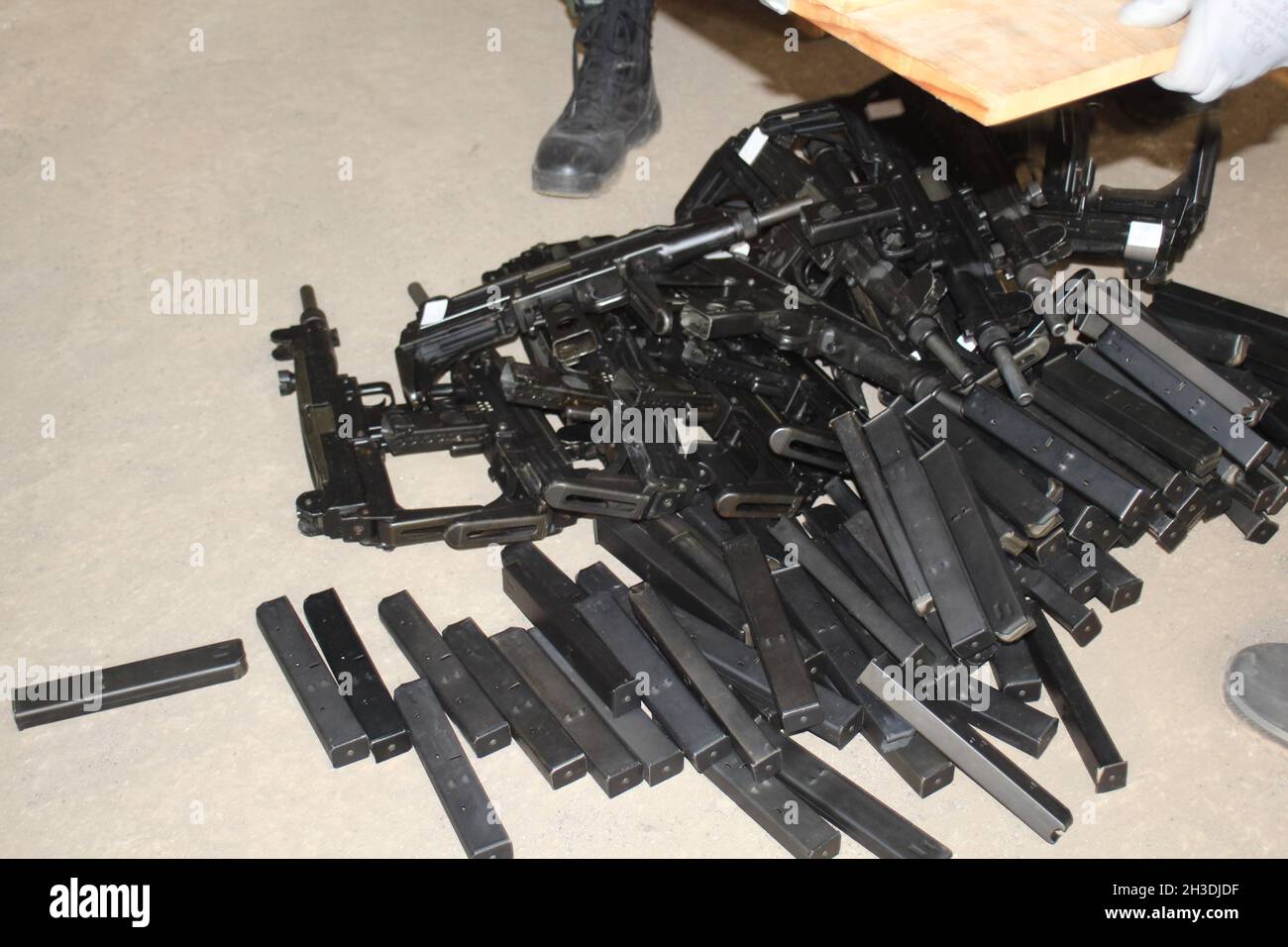 a pile of firearms ready to be destroyed Stock Photo - Alamy