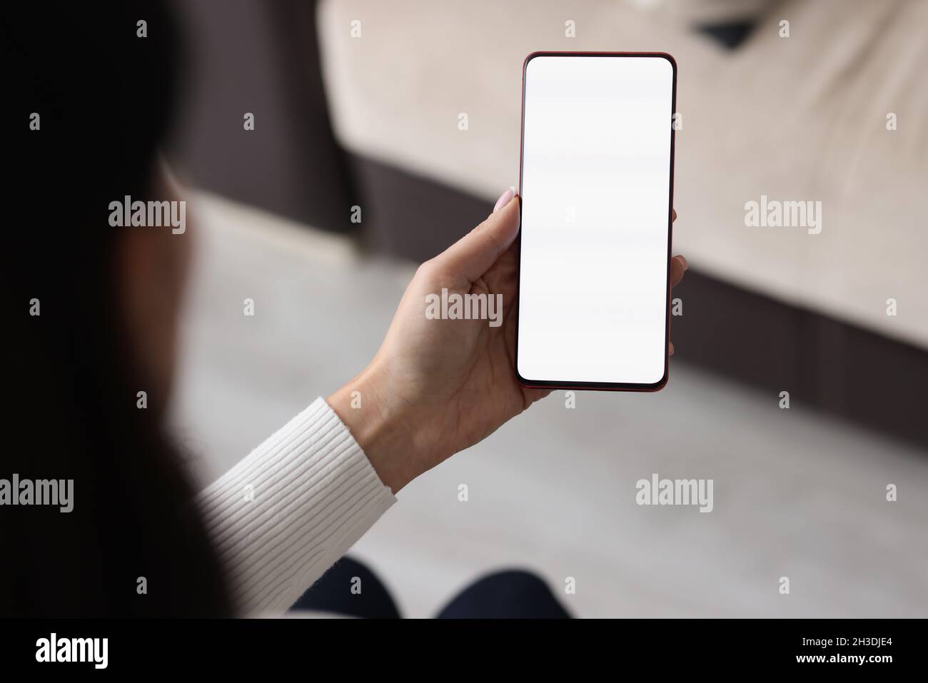 Close-up of female hand holding cellphone with blank display Stock ...