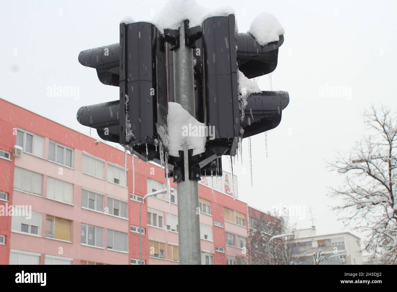 traffic light in winter under the snow in city downtown Stock Photo - Alamy