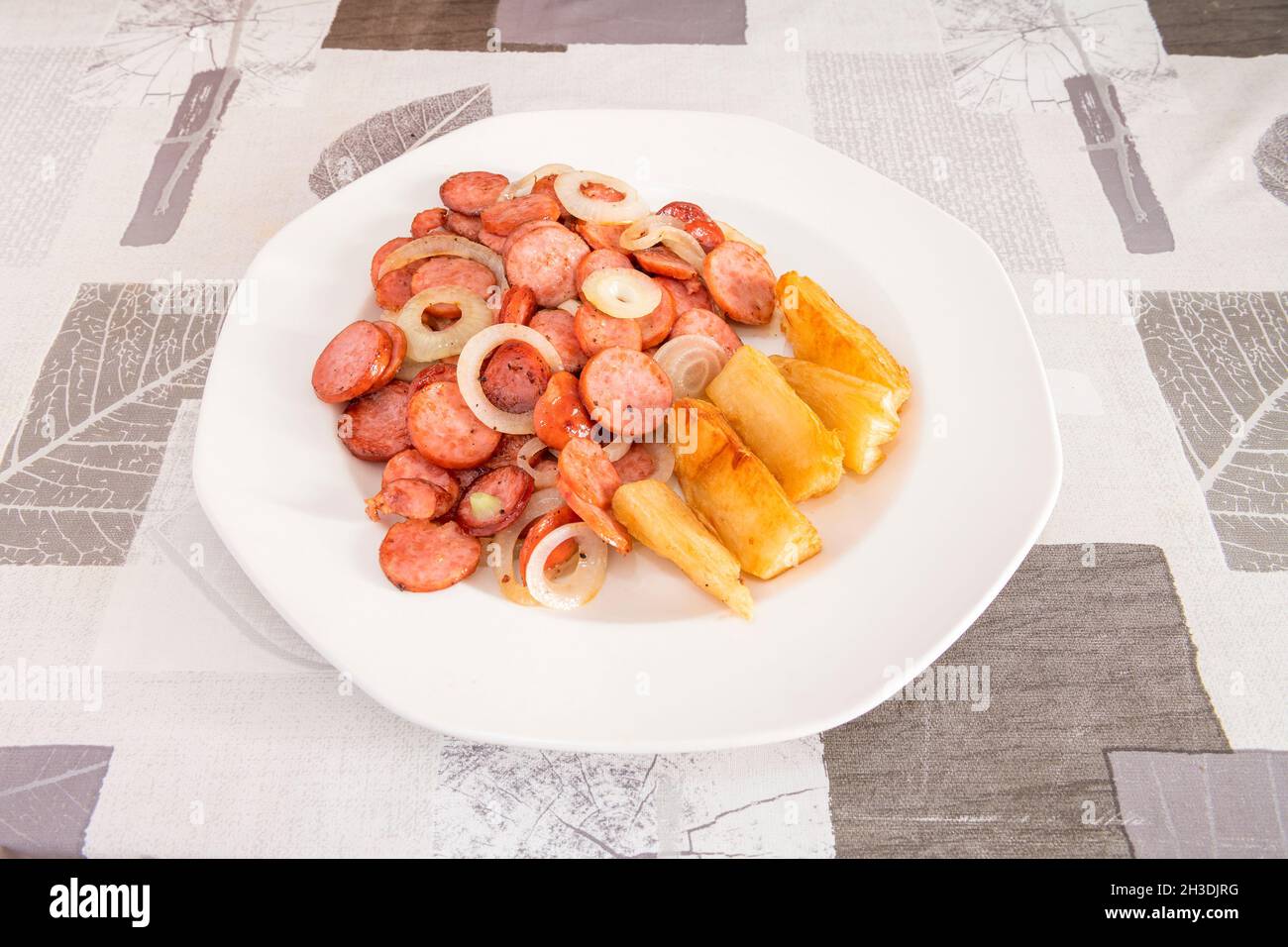 Chopped fried smoked chorizo with white onion rings and delicious fried ...