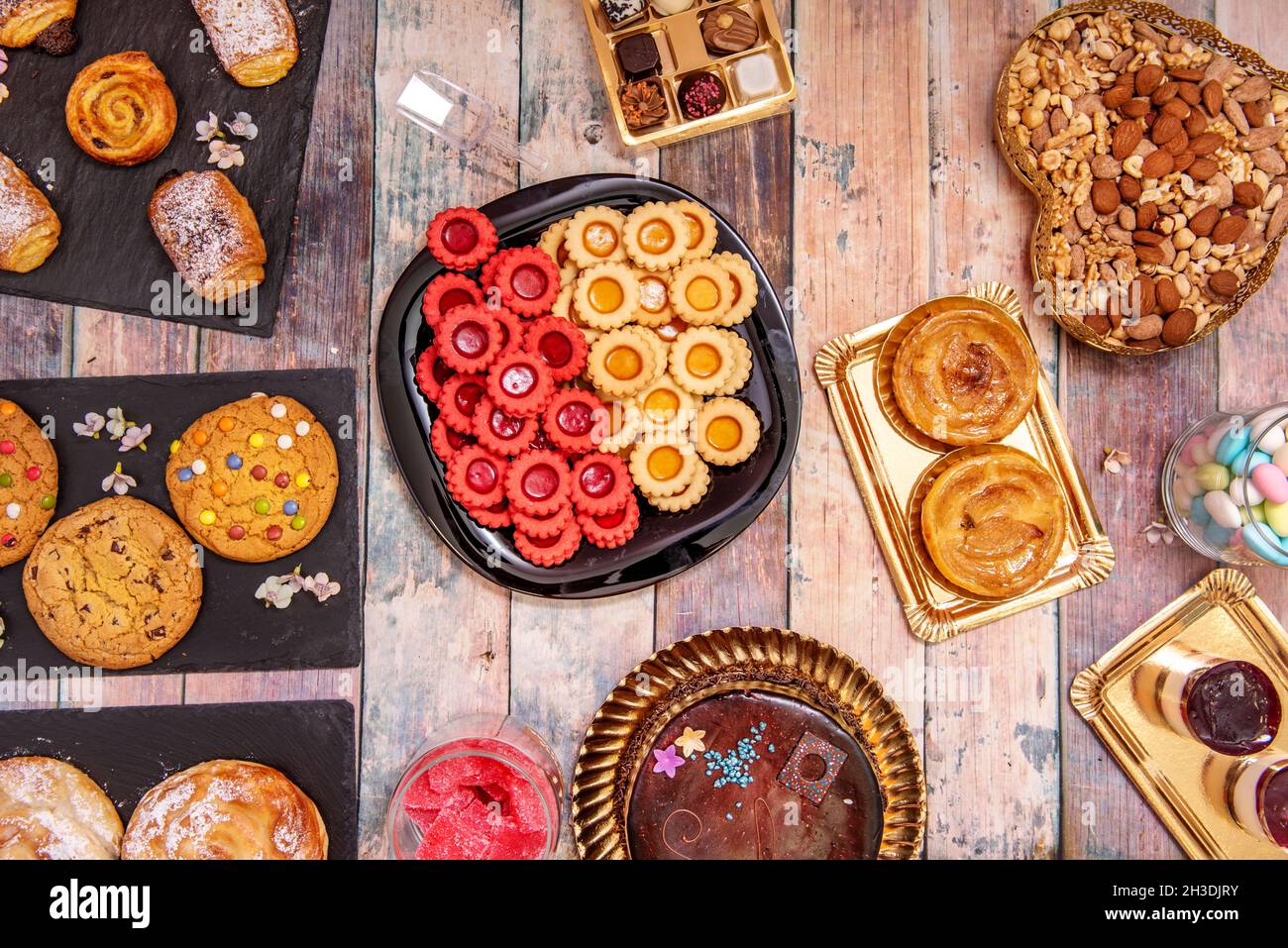 set of pastry plates with cookies, sacher chocolate cake, apple tart ...