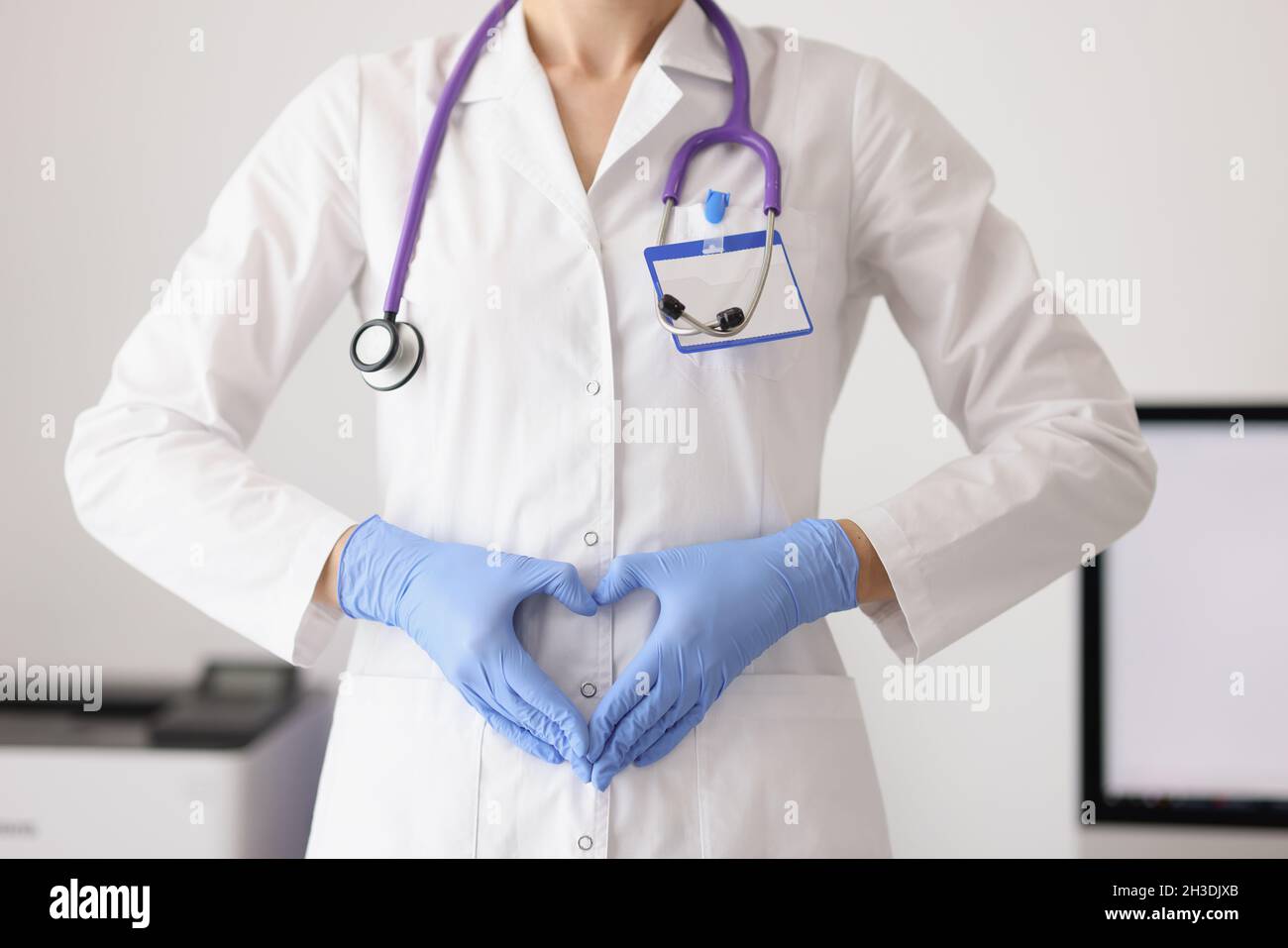 Woman showing heart sign with hands Stock Photo - Alamy
