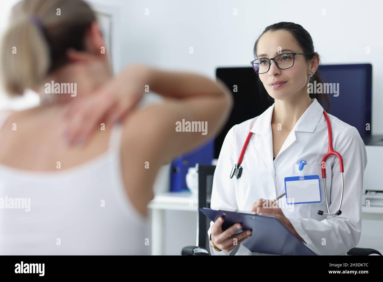 Sick woman at doctor appointment Stock Photo - Alamy