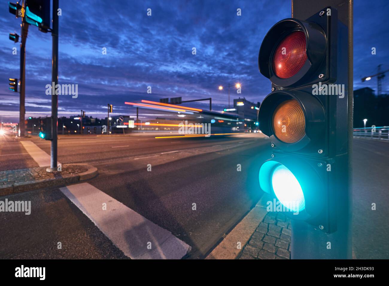 The traffic light near the busy street in a European city in the ...