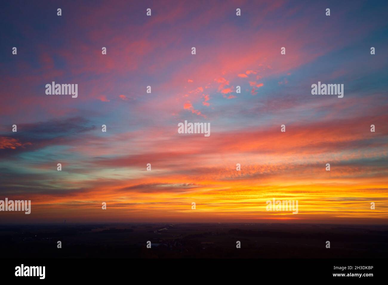 Beautiful dramatic sky with clouds at sunset. Natural sunrise over city ...