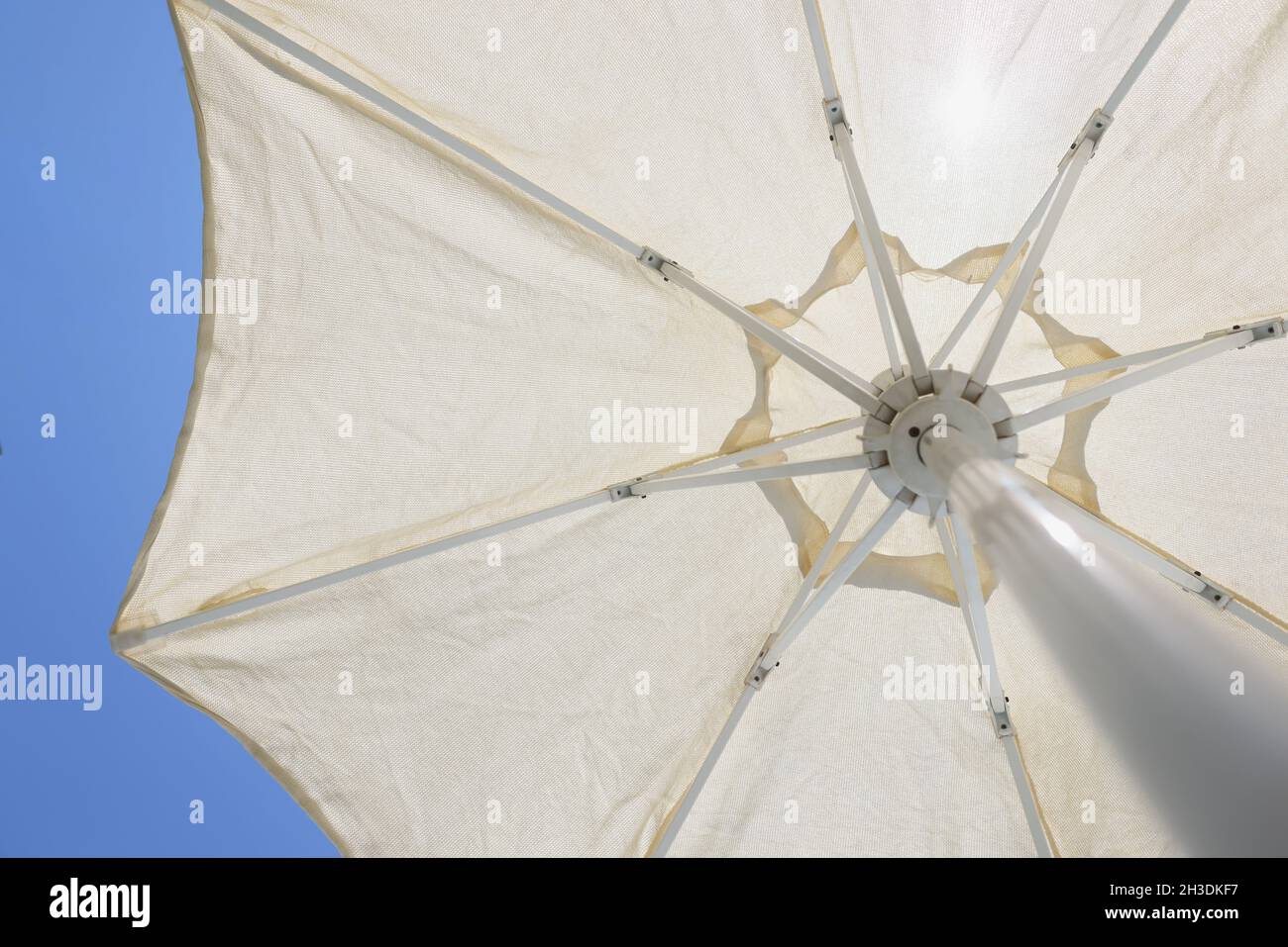 Sun rays fall on parasol Stock Photo - Alamy