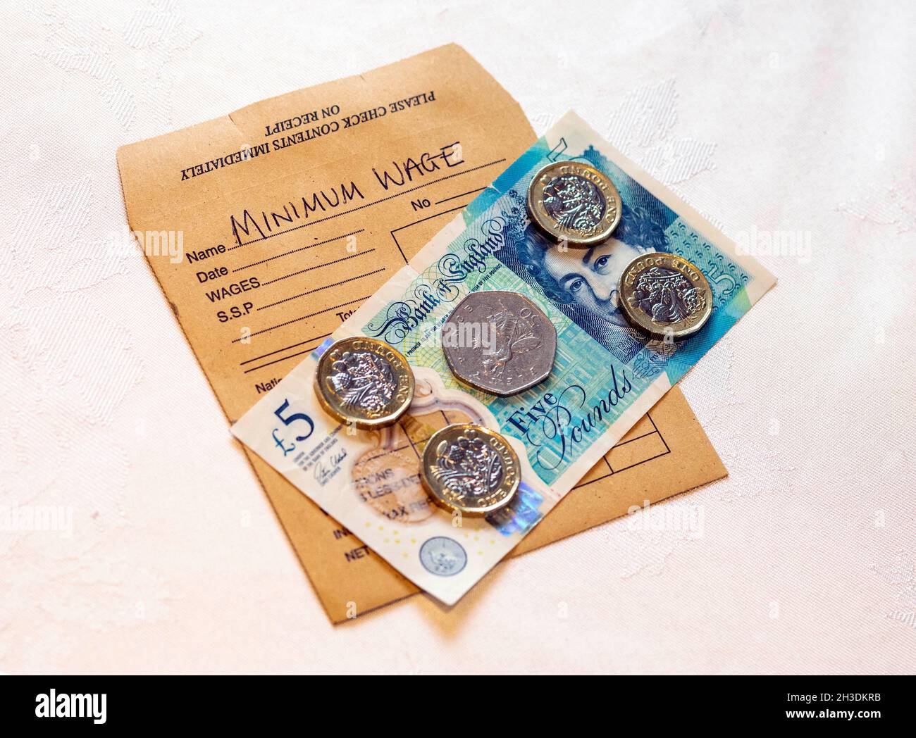 Pic shows: Budget 2021 Wage packet with nine pounds fifty pence on ti ...