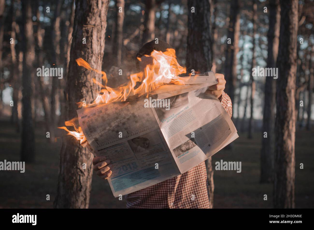 guy in the woods, camping, guy with fire Stock Photo - Alamy