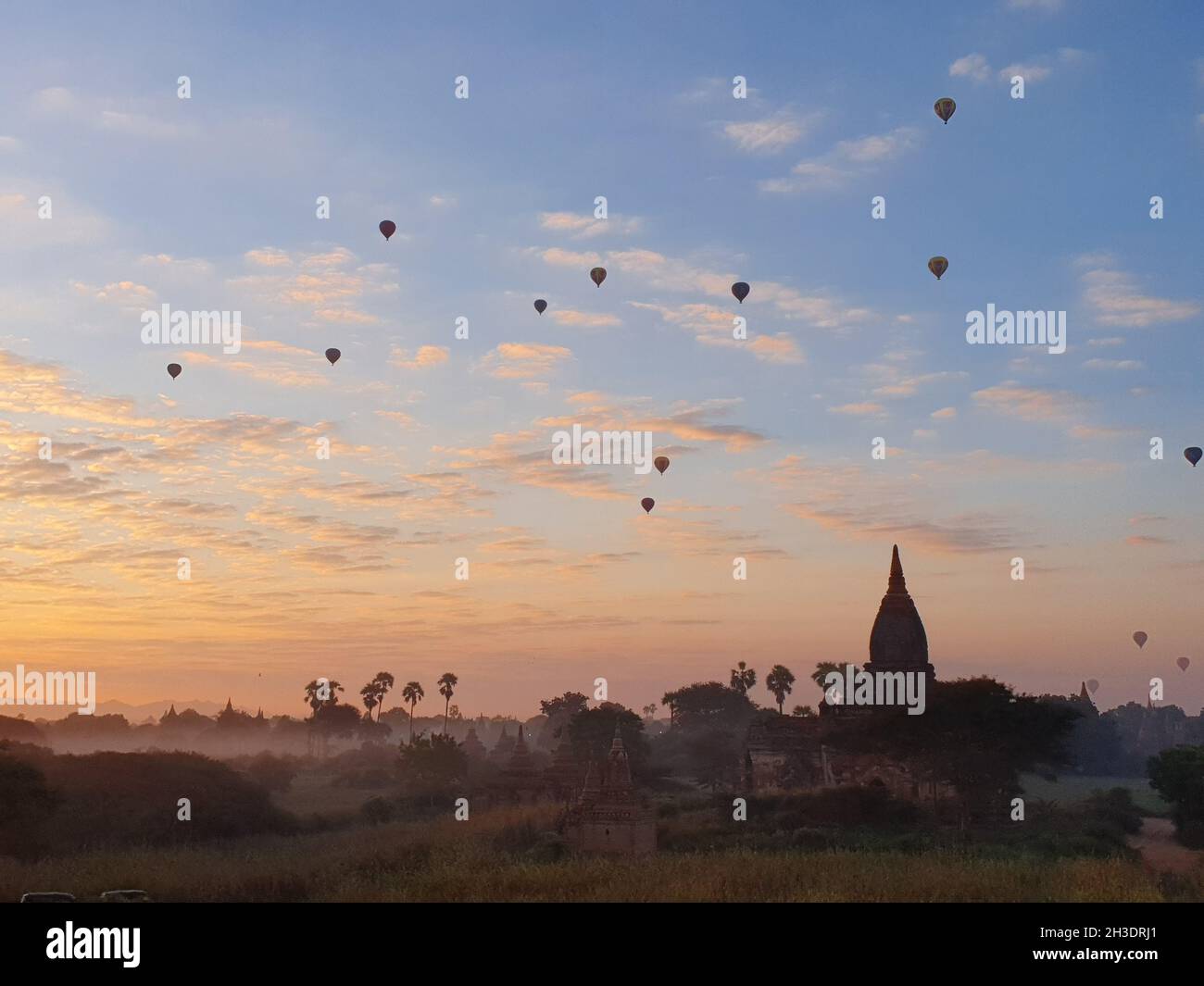 Beautiful sunrise and hot air balloons at the Bagan Archaeological ...
