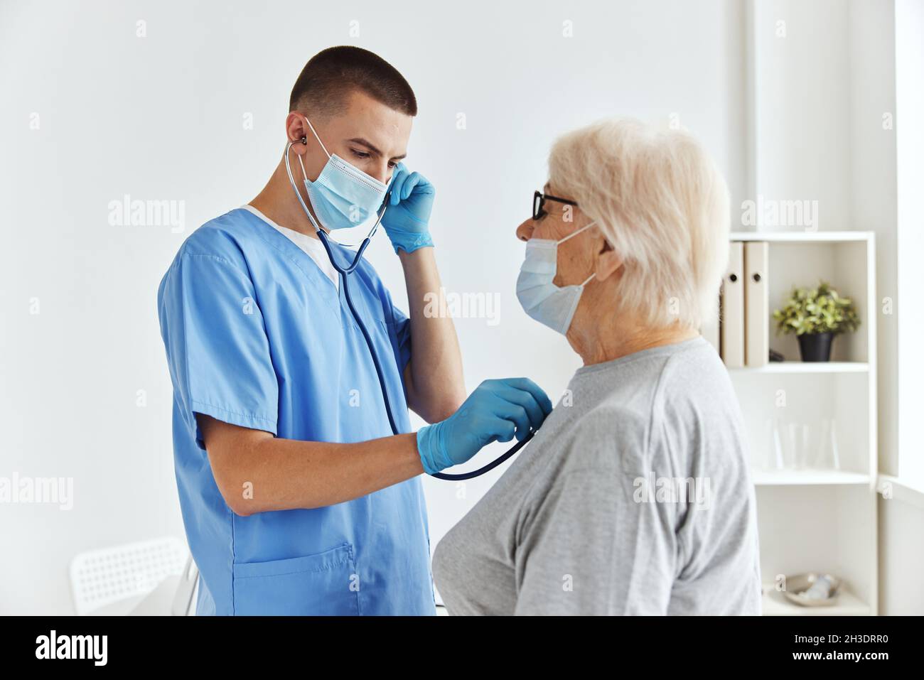Medical worker examine sick mature hi-res stock photography and images ...