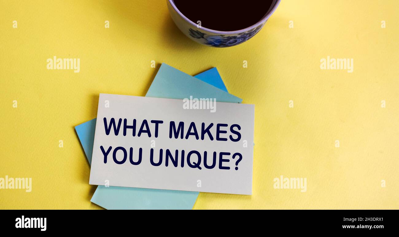 What makes you unique on the sticker and yellow background Stock Photo ...