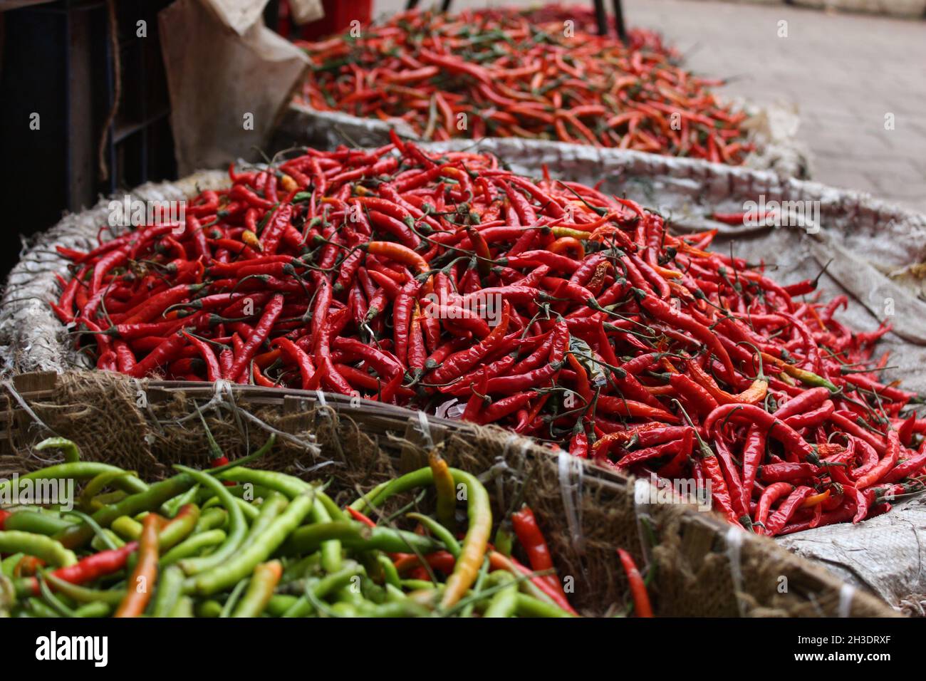 Varieties of chilies in the market of India (green, red, saffron Stock ...
