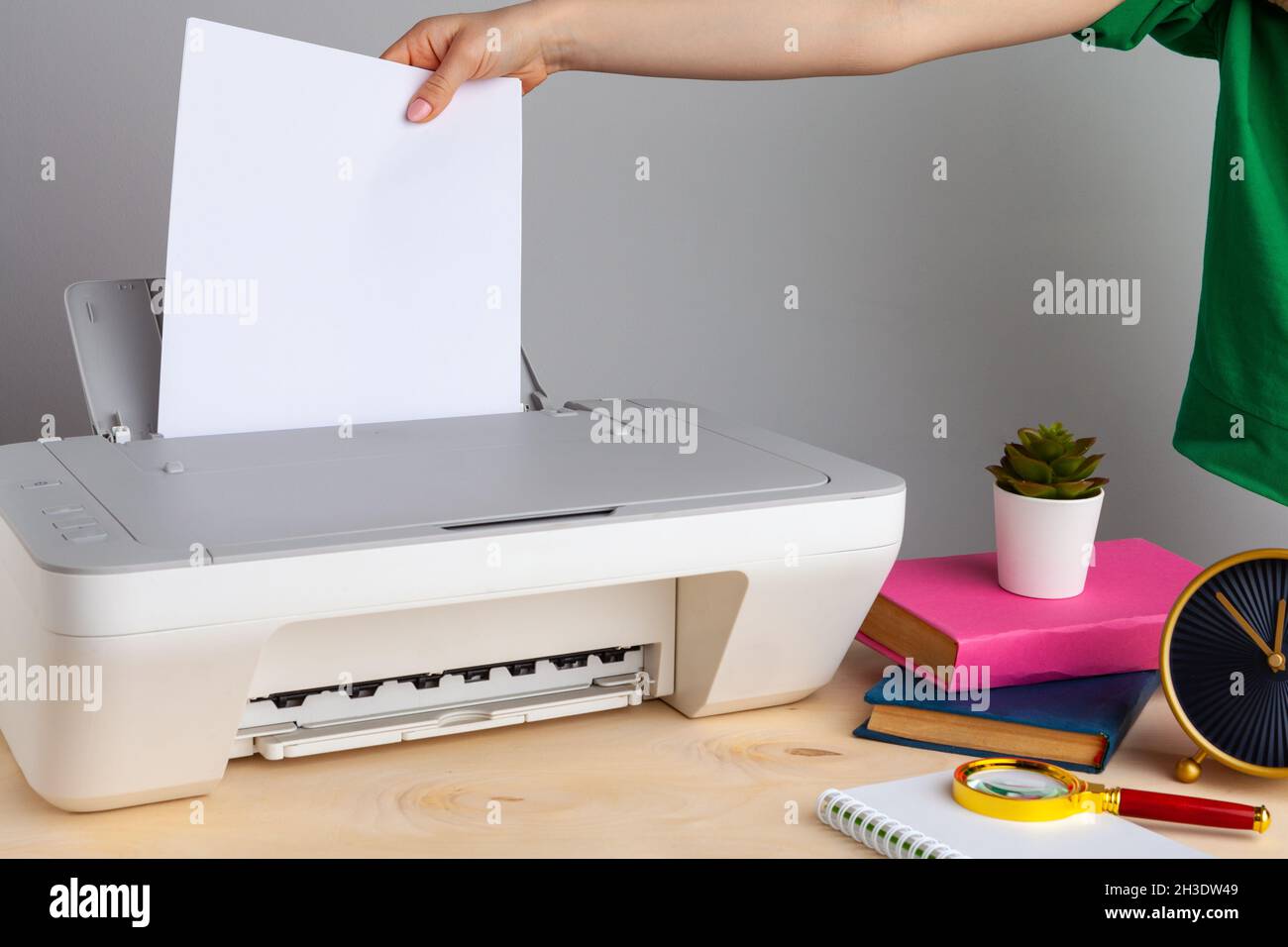 Close up of woman using a printer machine Stock Photo - Alamy