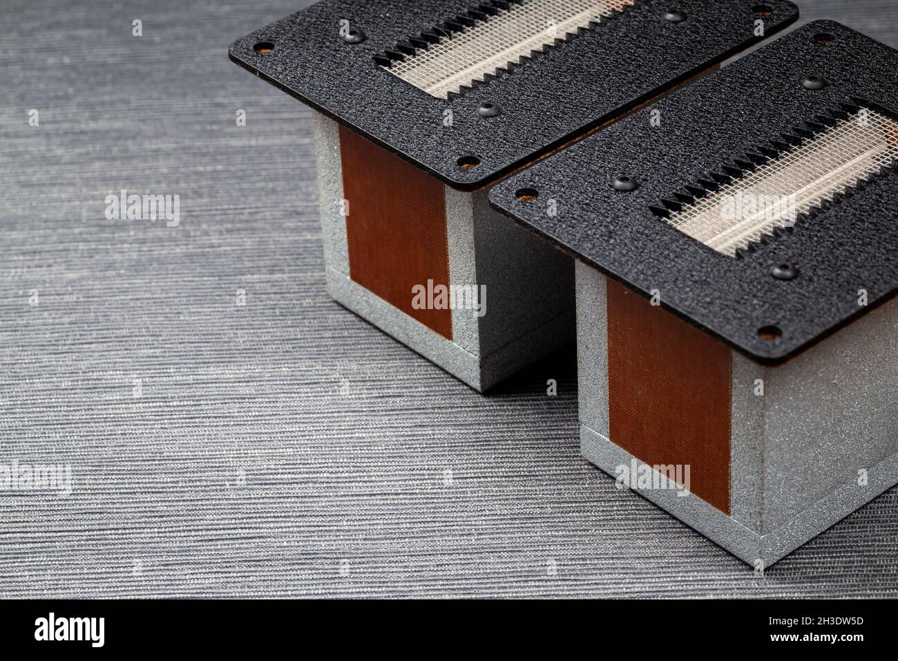 Flat foil ribbon tweeters presented against a gray background. Photo ...
