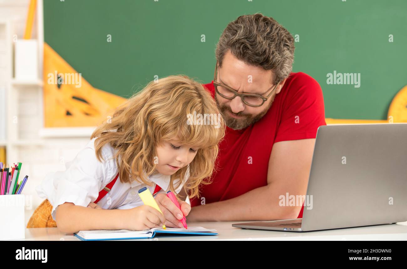 teacher and child study in classroom with laptop, family Stock Photo ...