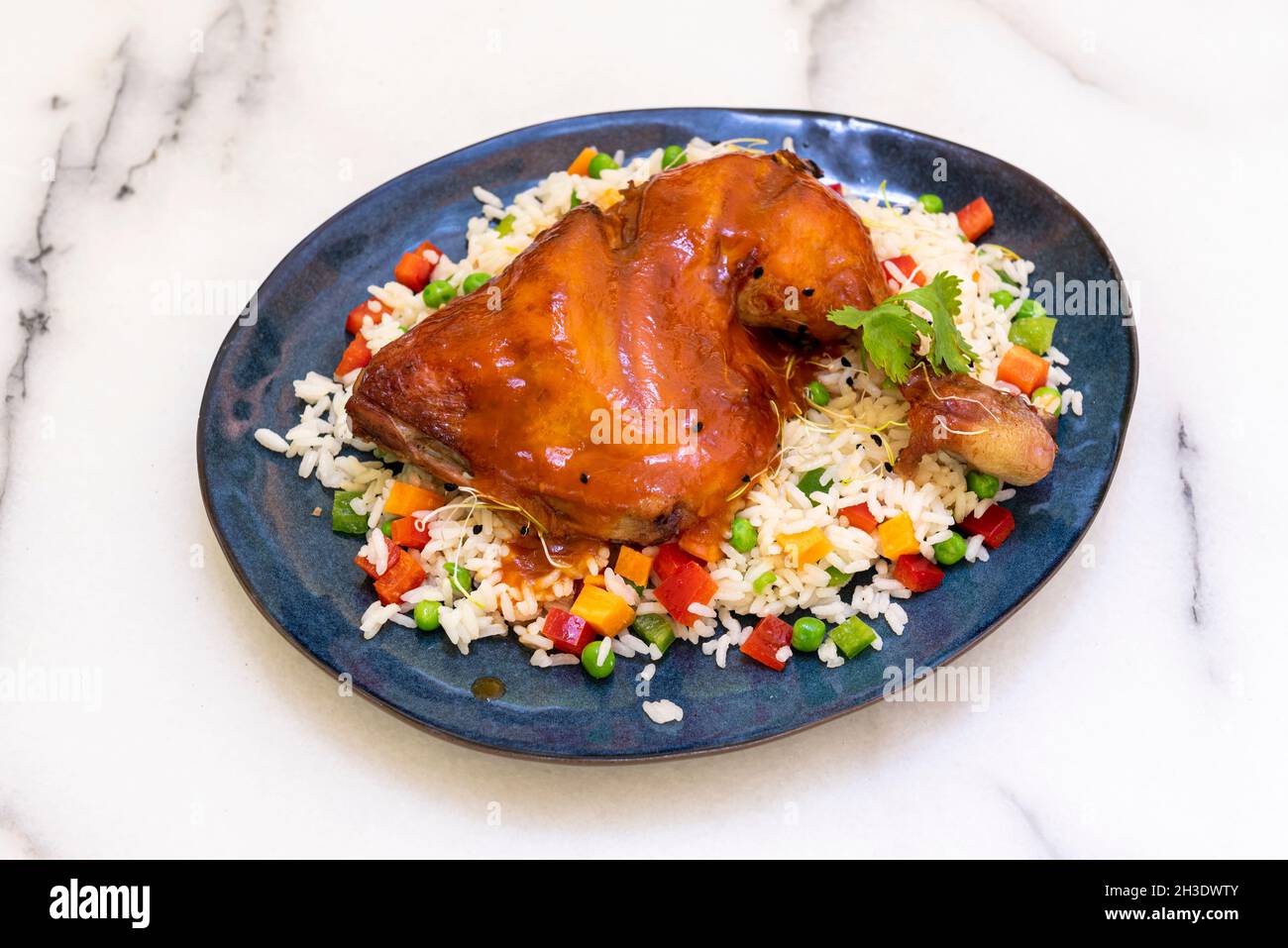 Chicken stew cooked with inasal Filipino recipe on a bed of white rice ...