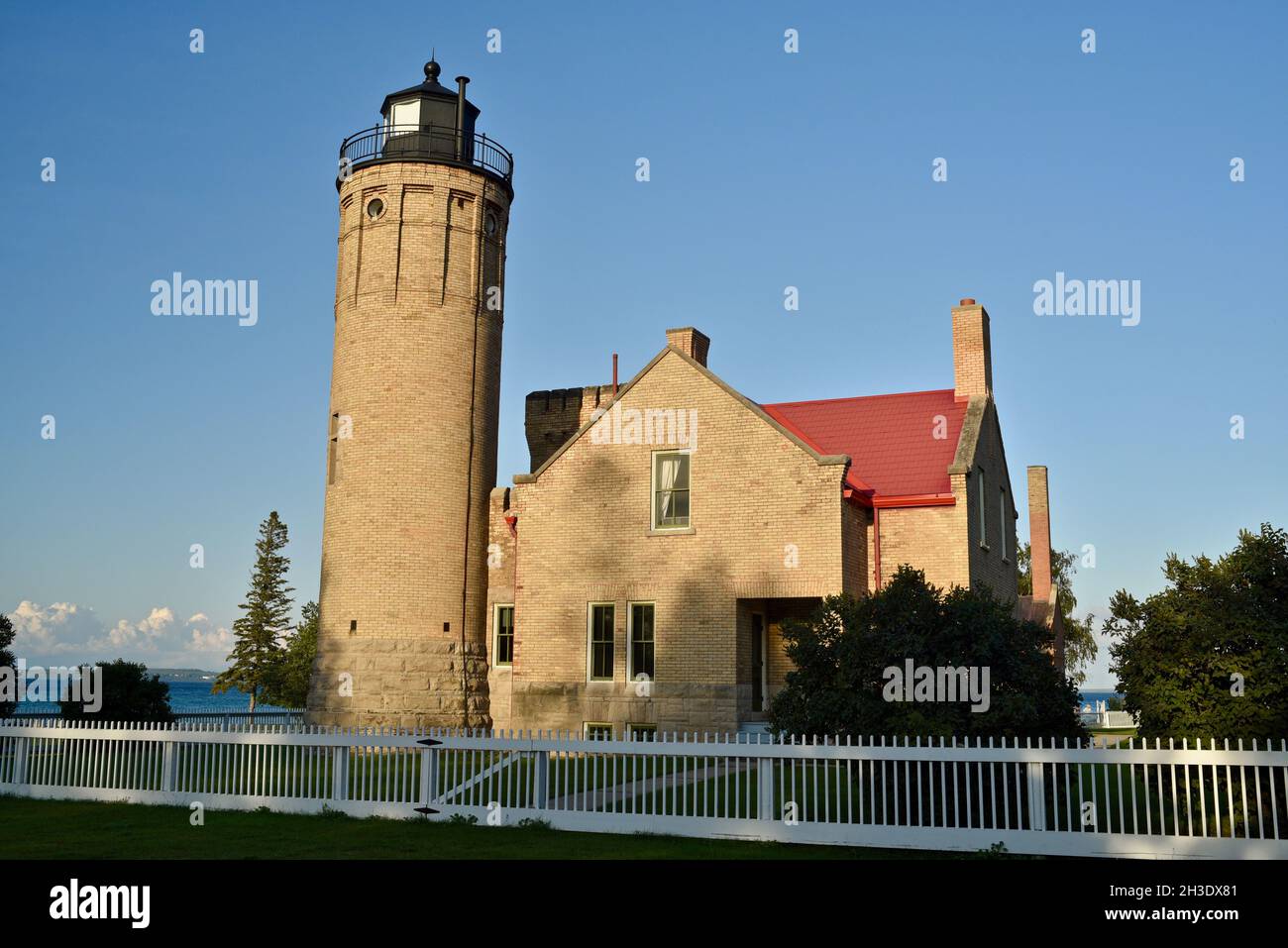 Brick house picket fence hi-res stock photography and images - Alamy