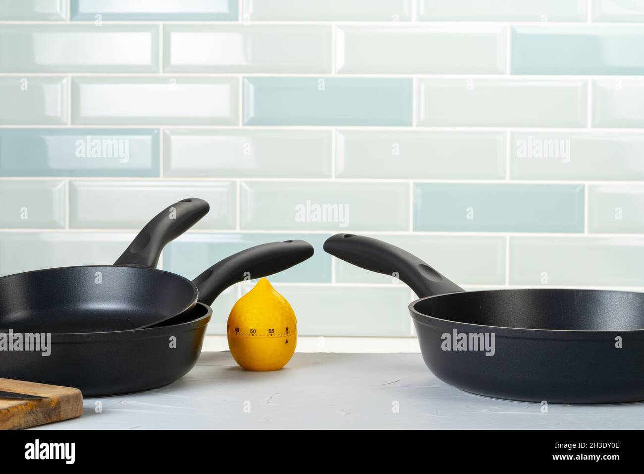 Clean and dry cooking pans on a kitchen counter Stock Photo - Alamy