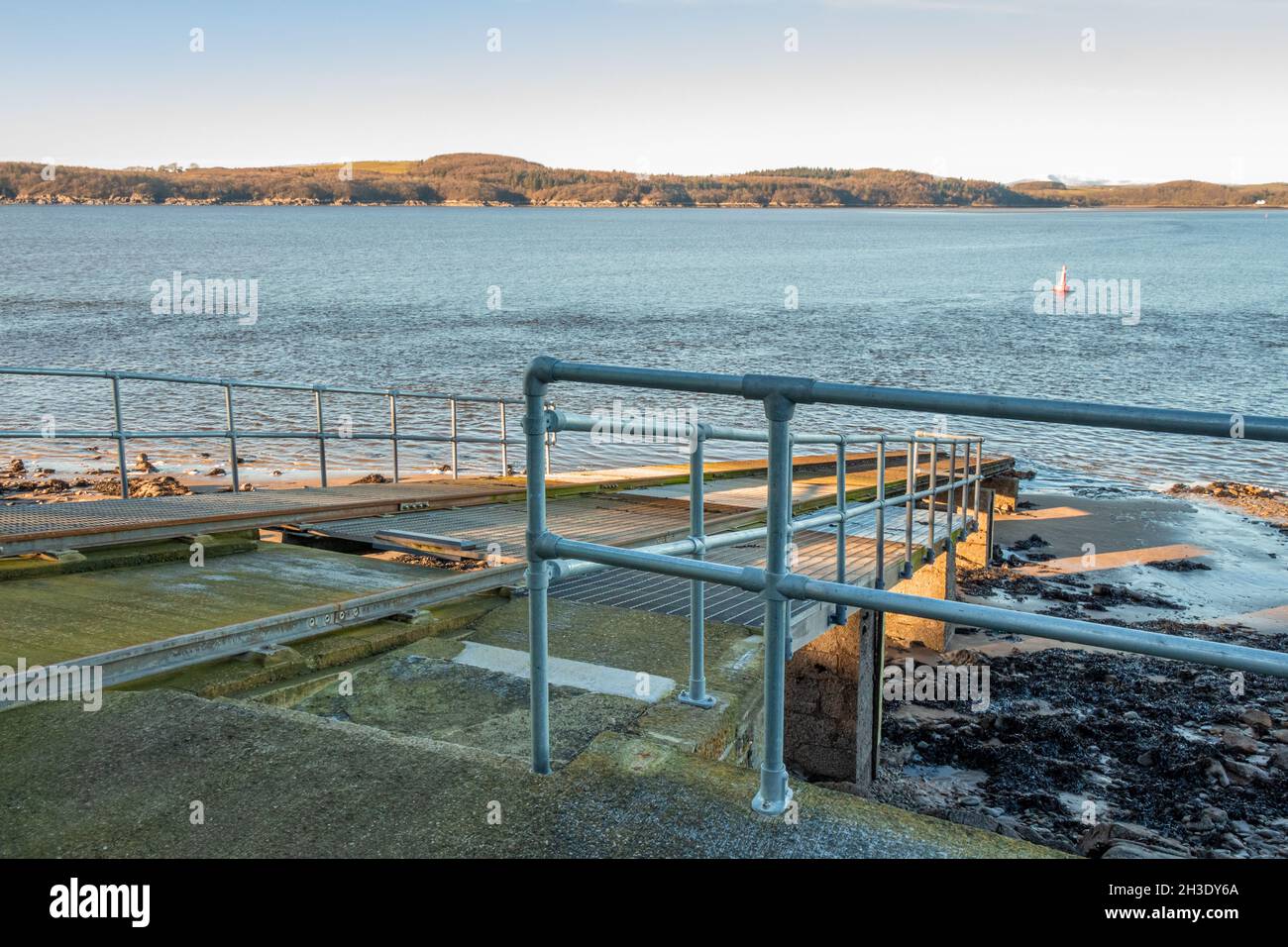 Close up of a concrete boat slipway at Kirkcudbright Bay in winter ...