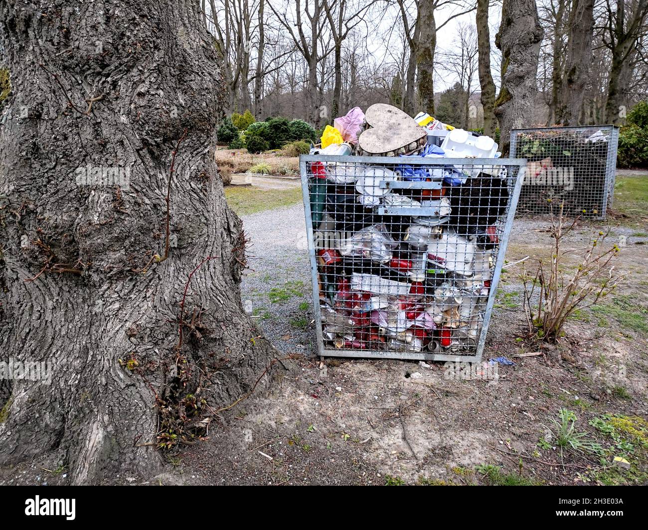 waste separation in a cemetery, full rubbish baskets Stock Photo - Alamy