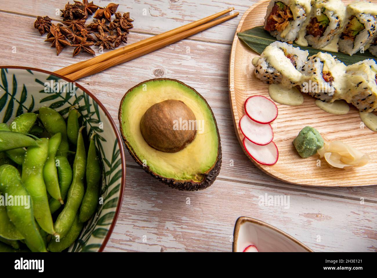 Japanese dishes with avocado, uramaki california roll sushi, pod ...