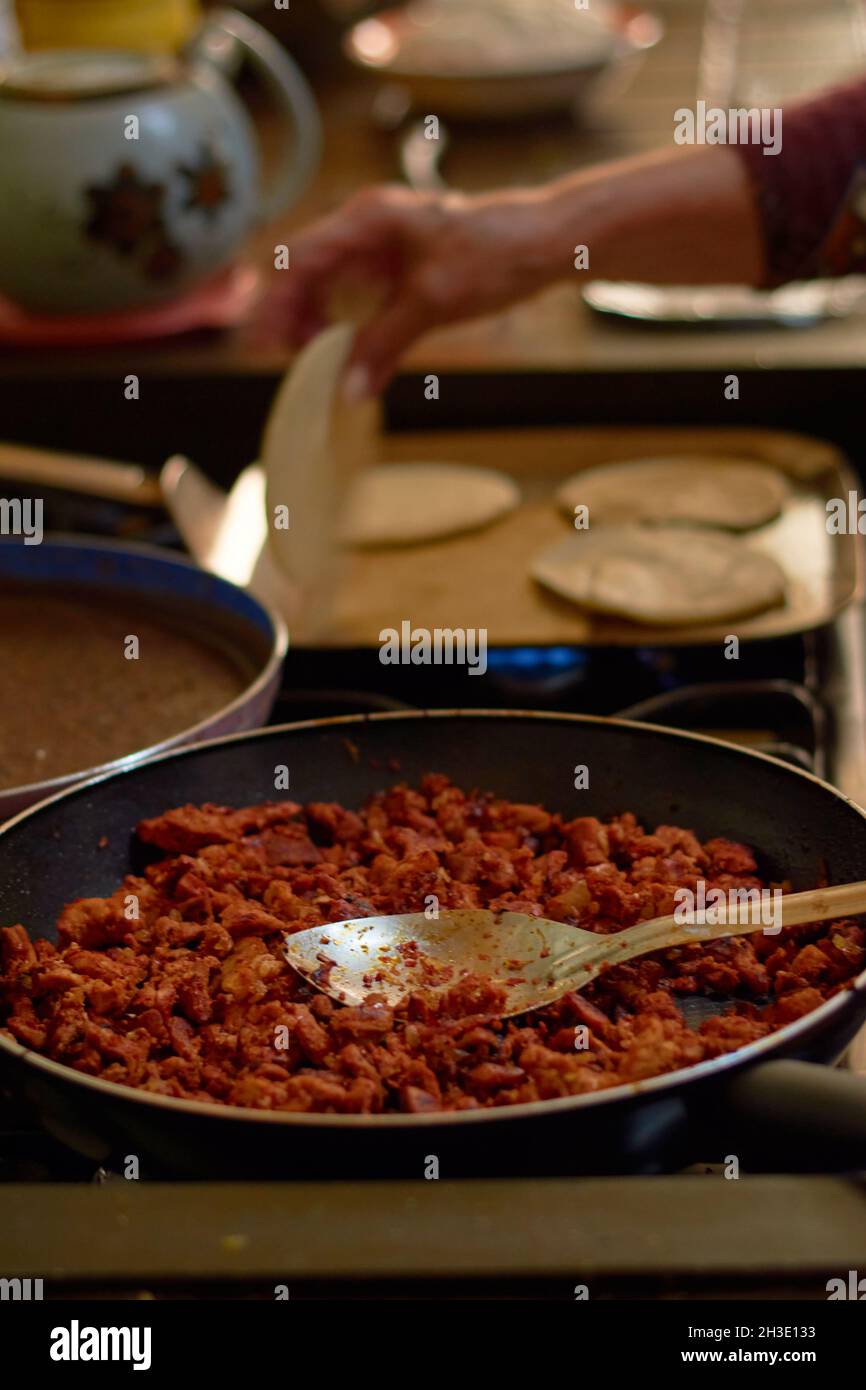 Grandmother's hand cooking tacos in traditional Mexican cuisine Stock ...