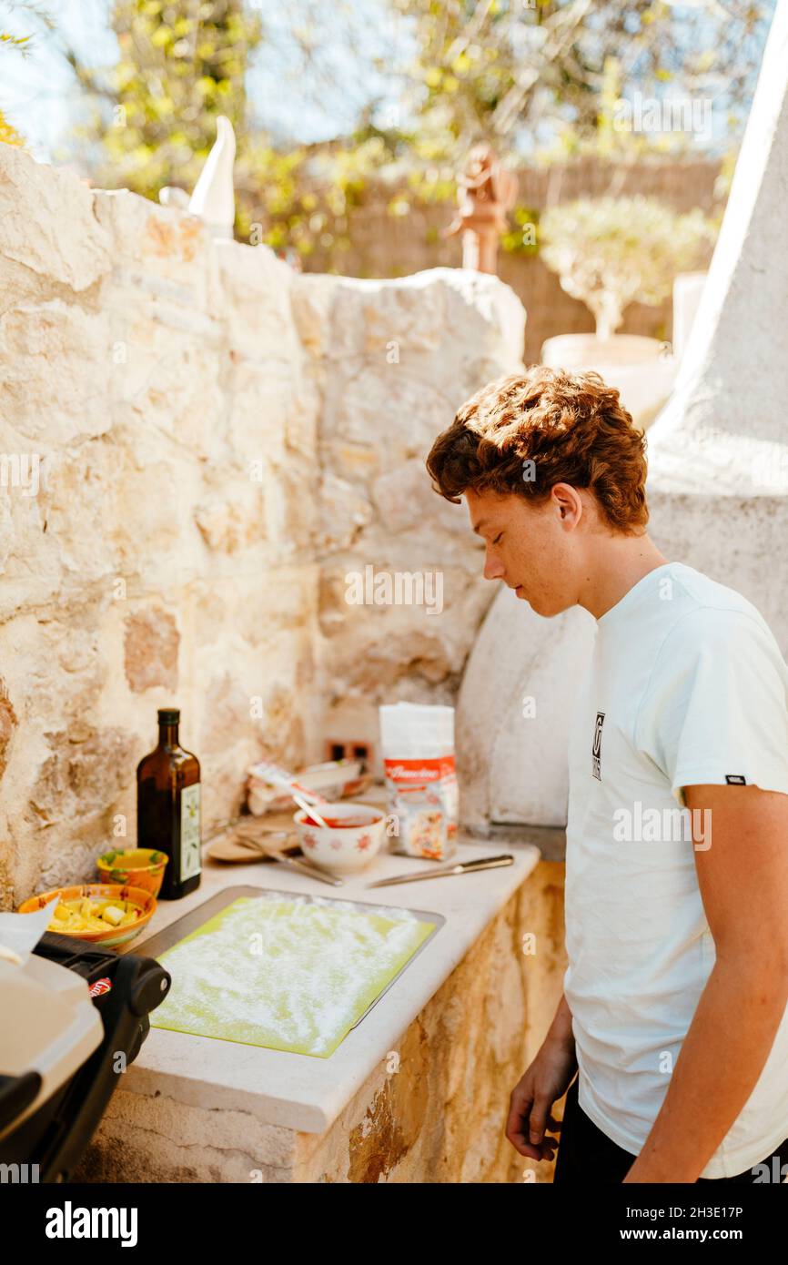 Homemade pizza baking with outdoor traditional pizza over Stock Photo ...