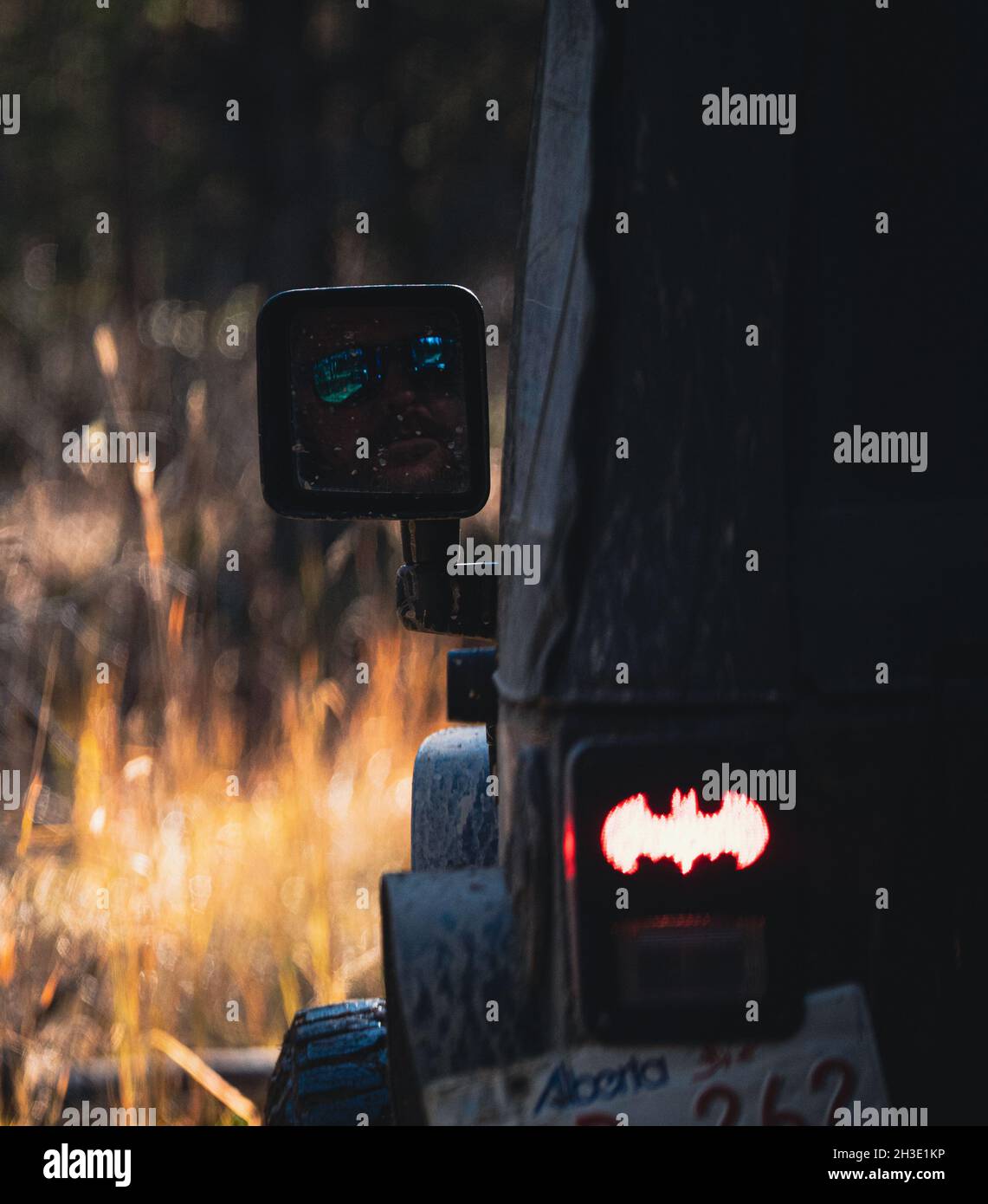 WAIPRUS, CANADA - Oct 25, 2021: Caucasian male seen in side mirror ...