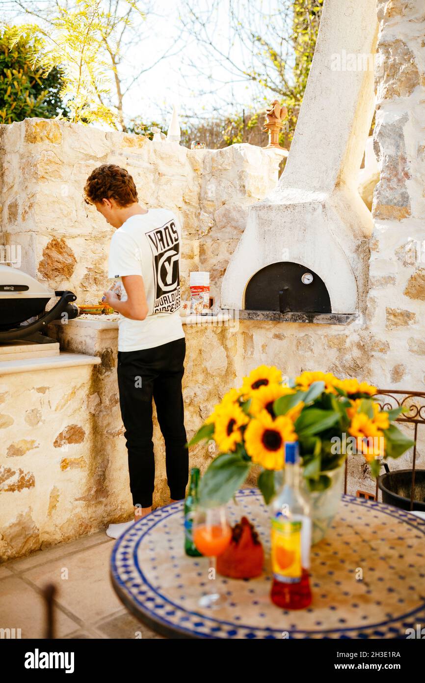 Homemade pizza baking with outdoor traditional pizza over Stock Photo ...