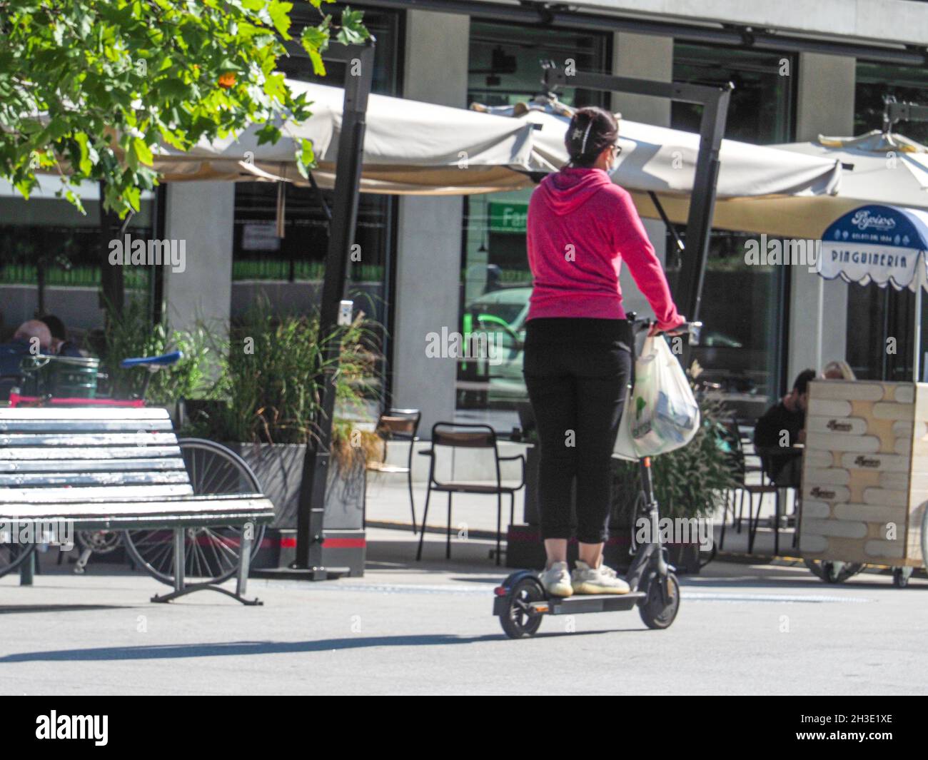Girl riding electric scooter hi-res stock photography and images - Alamy