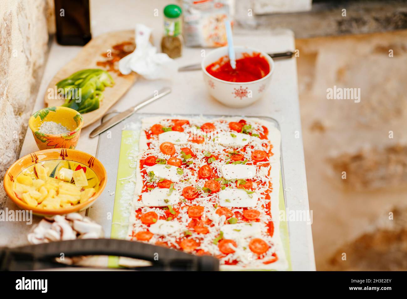 Homemade pizza baking with outdoor traditional pizza over Stock Photo ...