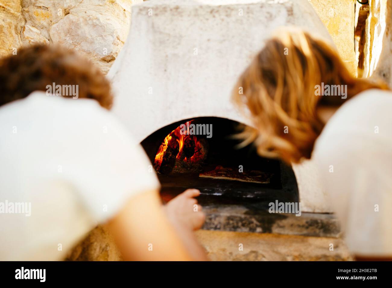 Homemade pizza baking with outdoor traditional pizza over Stock Photo ...