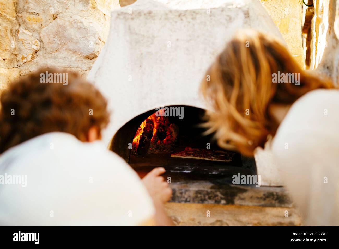 Homemade pizza baking with outdoor traditional pizza over Stock Photo ...