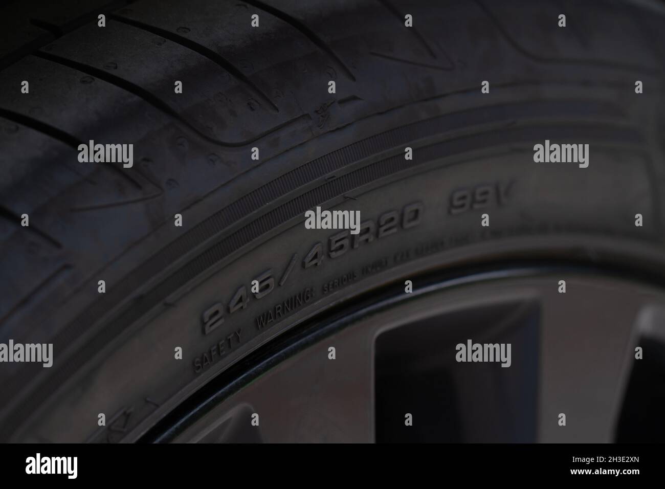 Close up view of tire with tire width, height and wheel diameter ...
