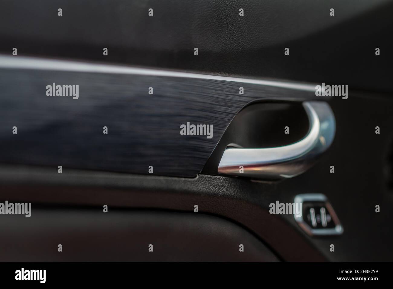 Modern car interior door handle close up. Metallic Car door opener ...