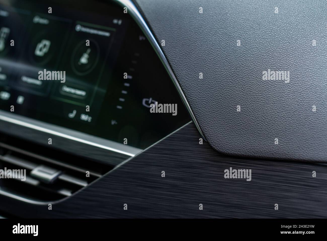 Modern car interior close up view with metallic and plastic details ...