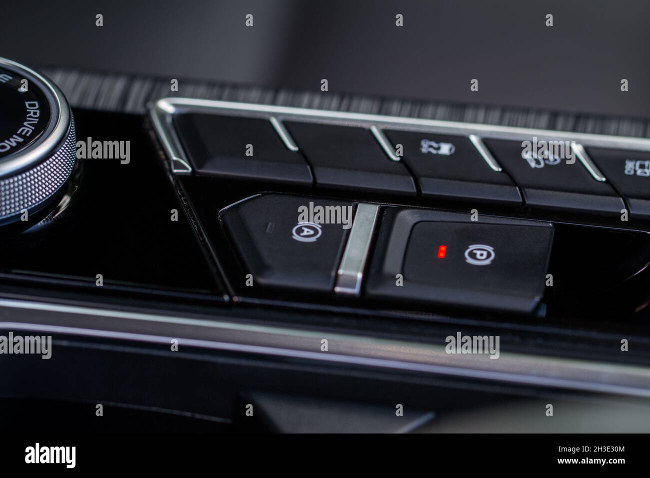 Electric handbrake button of modern car. Modern parking brake close up ...