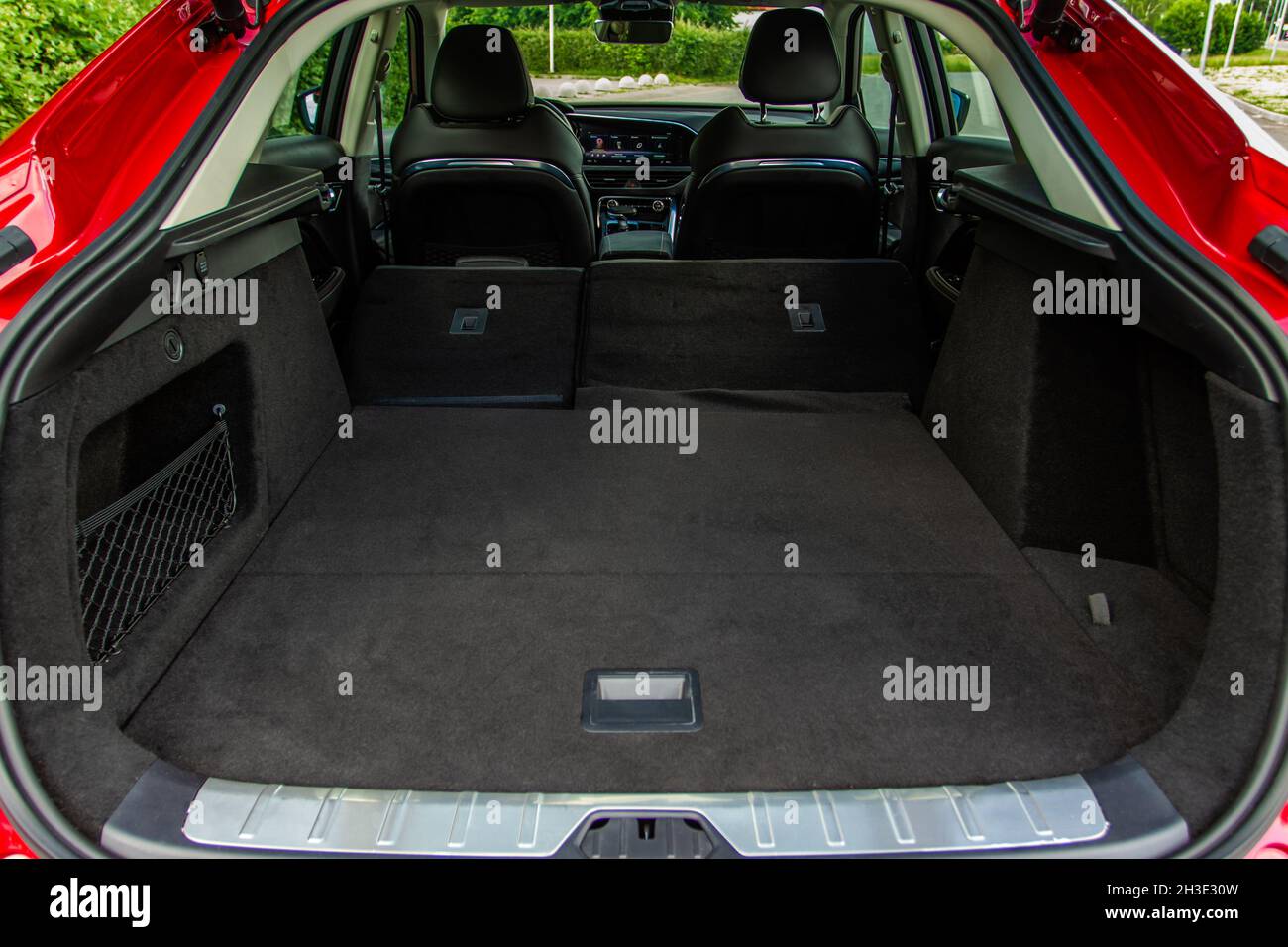 Huge, clean and empty car trunk in interior of compact suv. Rear view ...