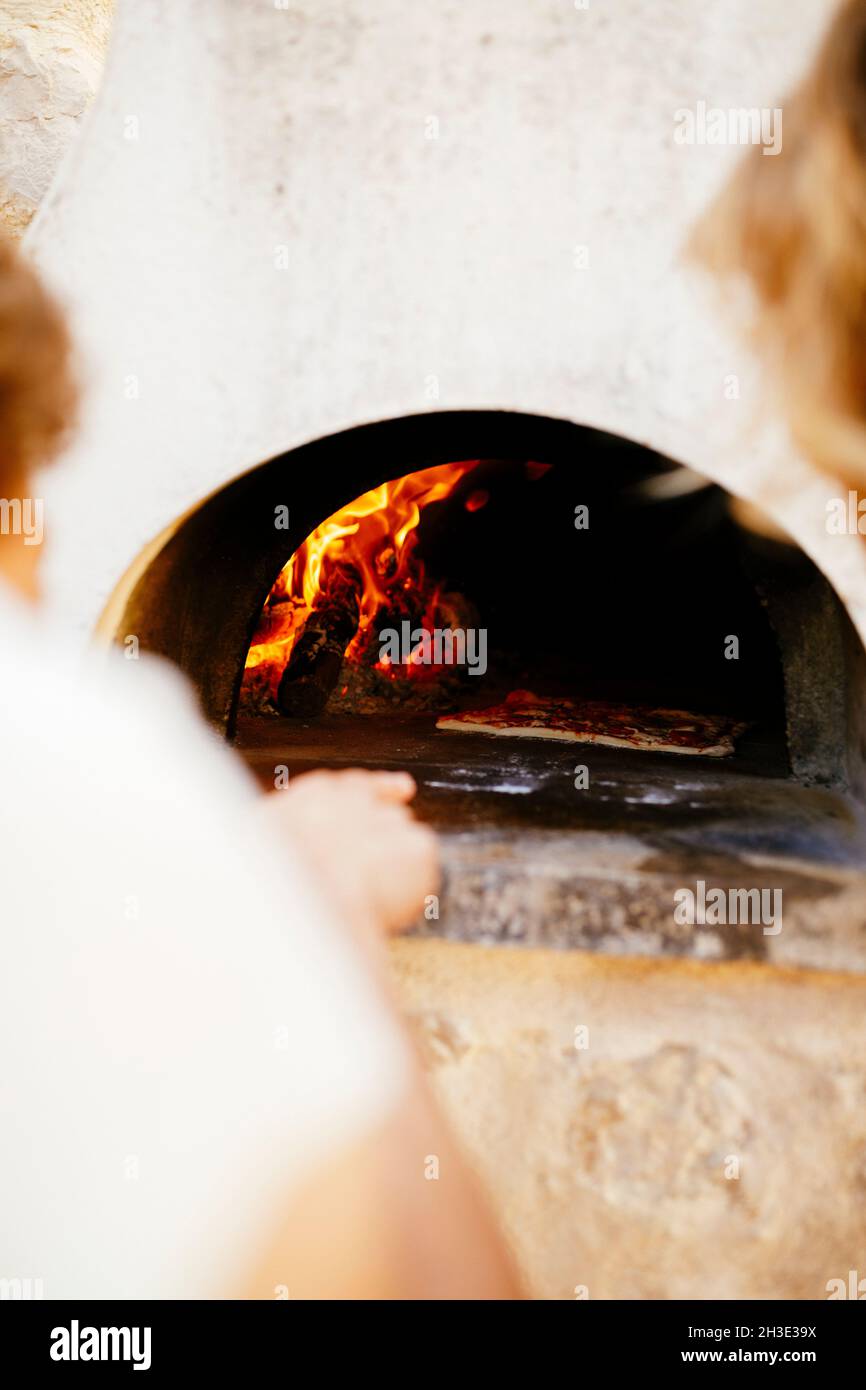 Homemade pizza baking with outdoor traditional pizza over Stock Photo ...